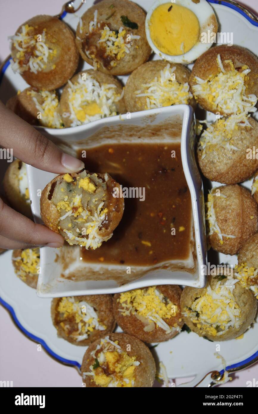 A picture of someone holding a fuska Stock Photo - Alamy