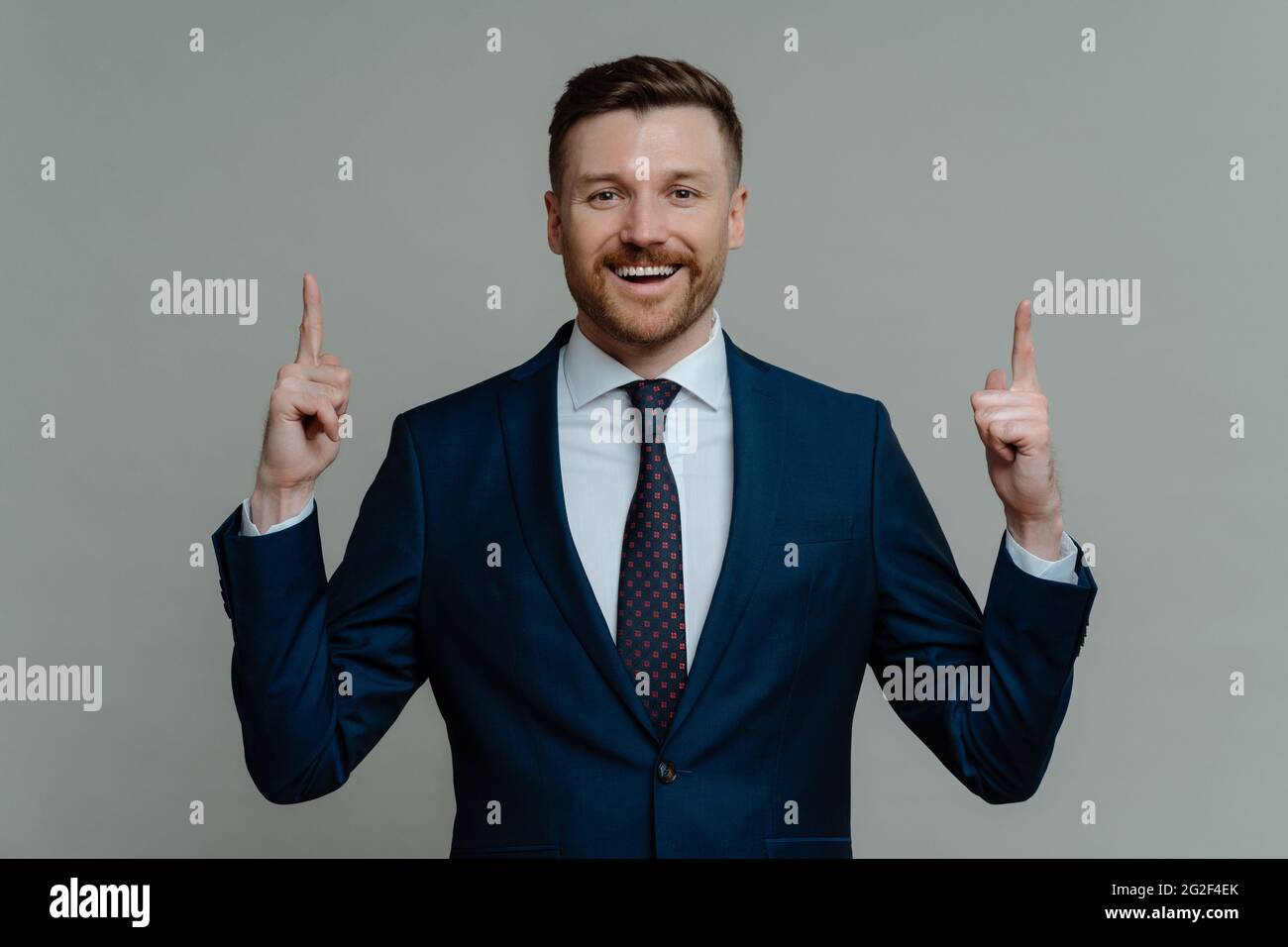 Man showing two fingers suit hi-res stock photography and images - Alamy