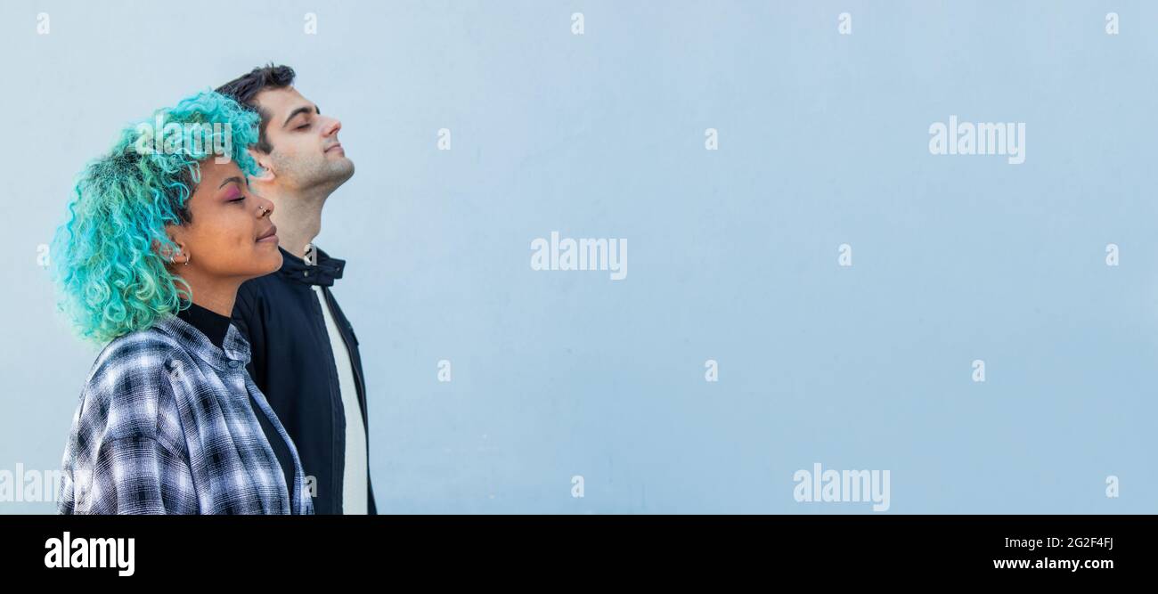 portrait of concentrated multiethnic couple breathing Stock Photo - Alamy
