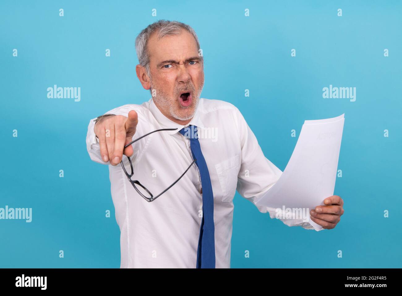 angry screaming businessman isolated on background Stock Photo - Alamy