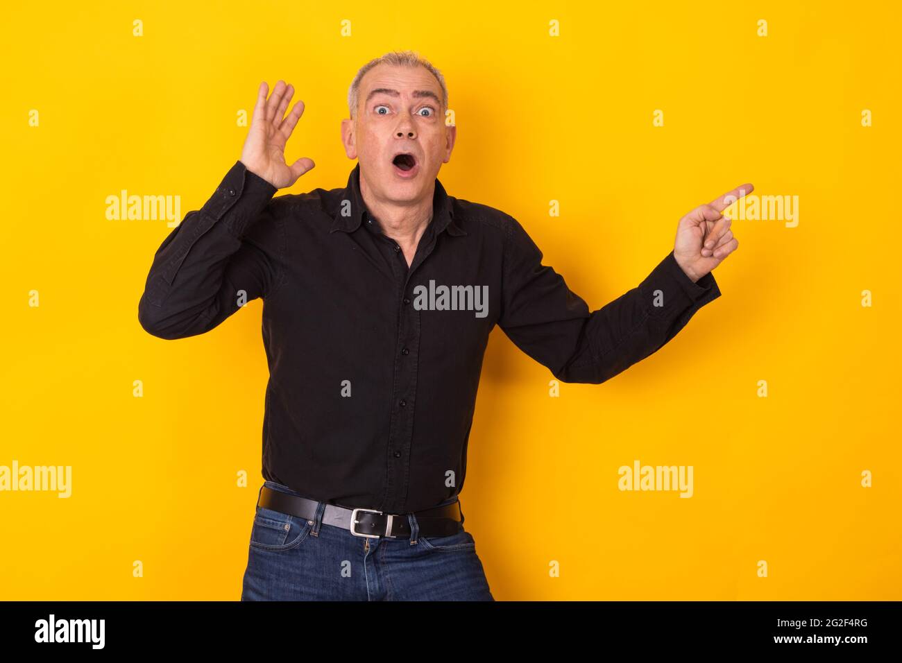 isolated adult man pointing with surprise Stock Photo - Alamy
