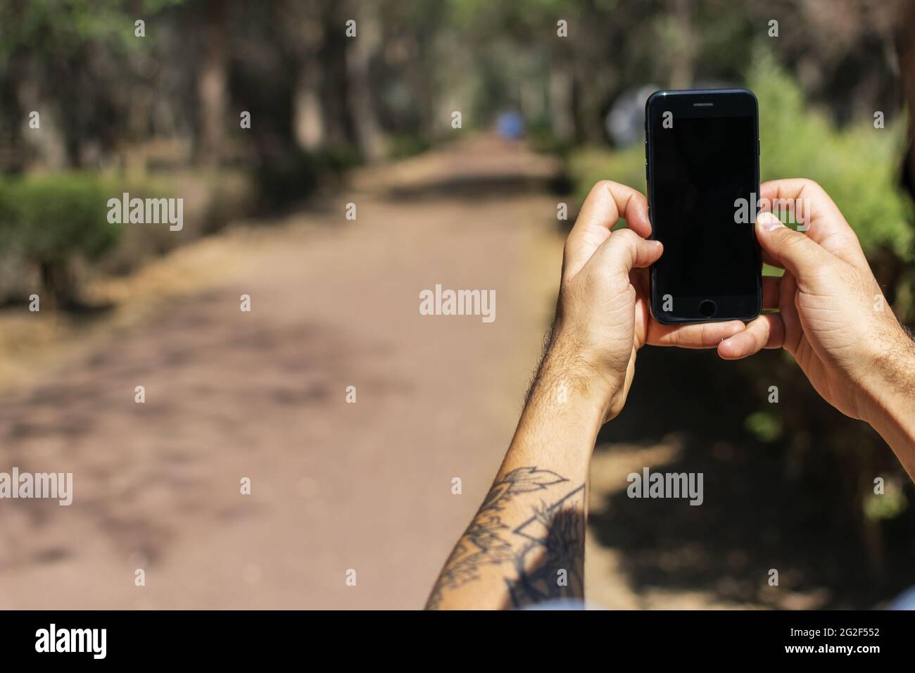 Fitness man runner using smart phone texting activity tracking. Active ...