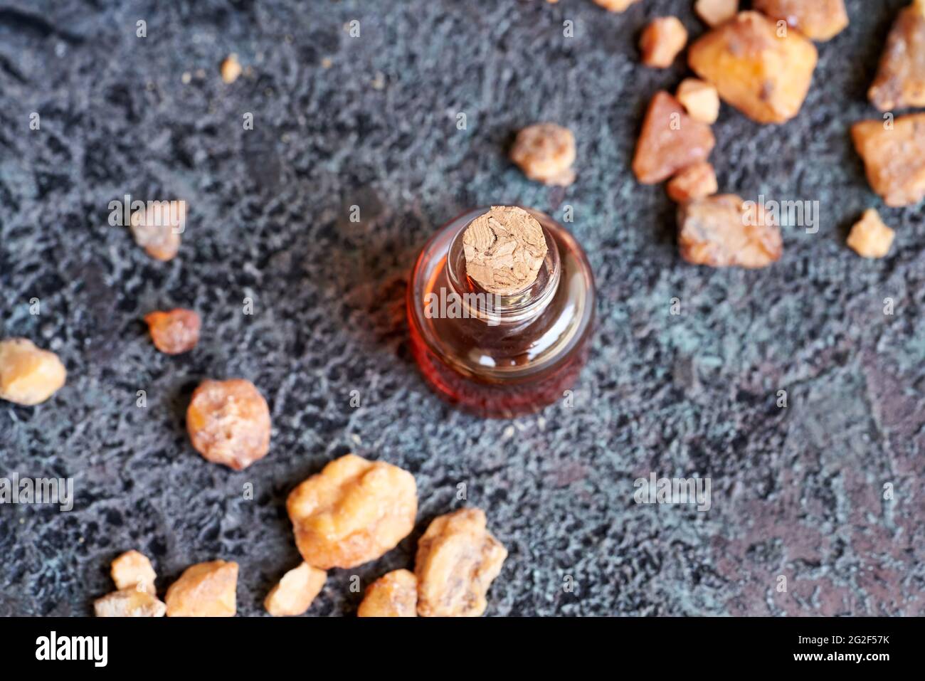 A bottle of styrax essential oil with benzoin resin. Aromatherapy or ...