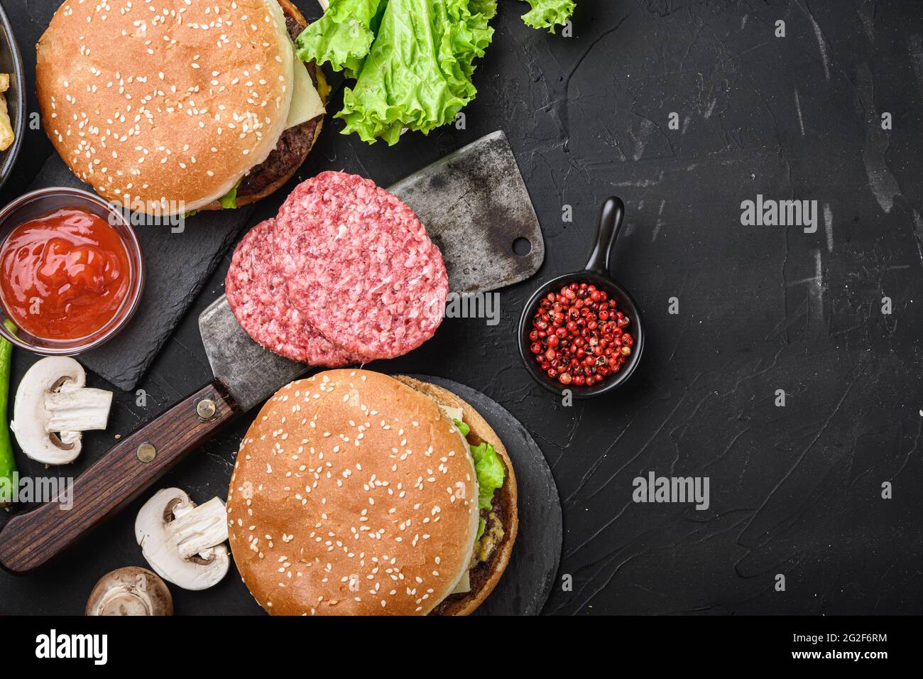 Ground beef steaks for home made burger on black background, top view ...