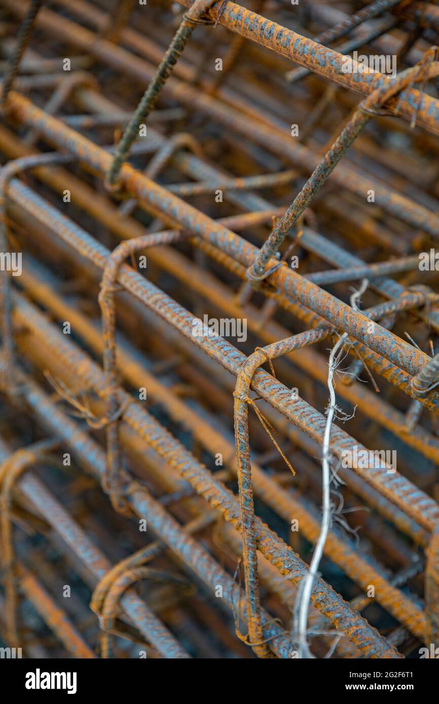 Vertical shot of rusty metal armature frameworks stacked on each other ...