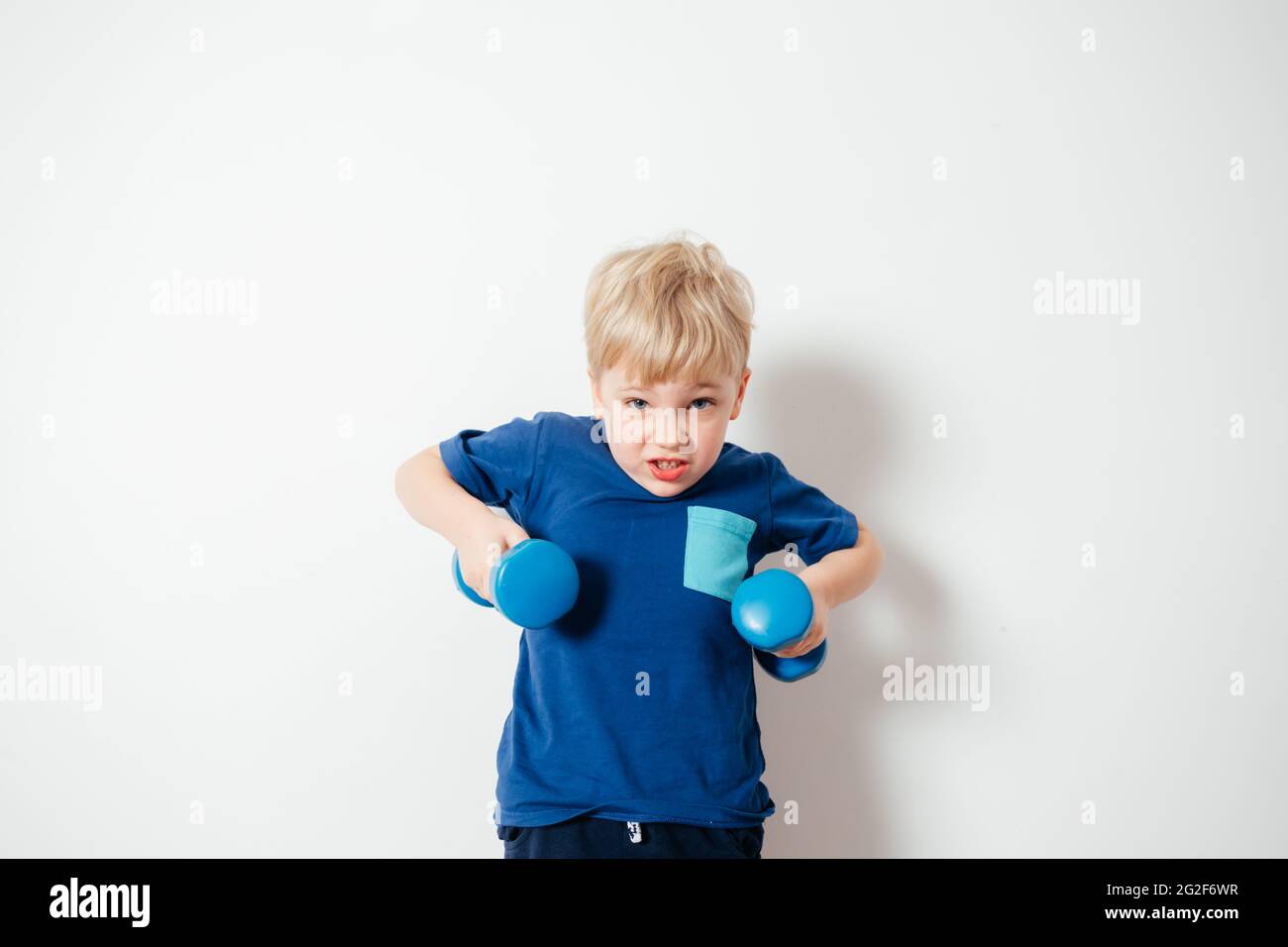 Active kids doing sport by following parents example Stock Photo - Alamy