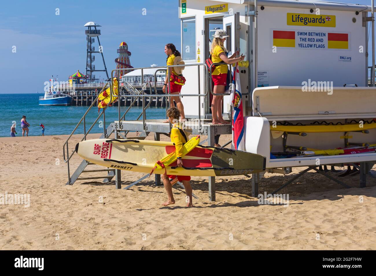 RNLI Lifeguards getting ready for the day on a hot sunny day at ...