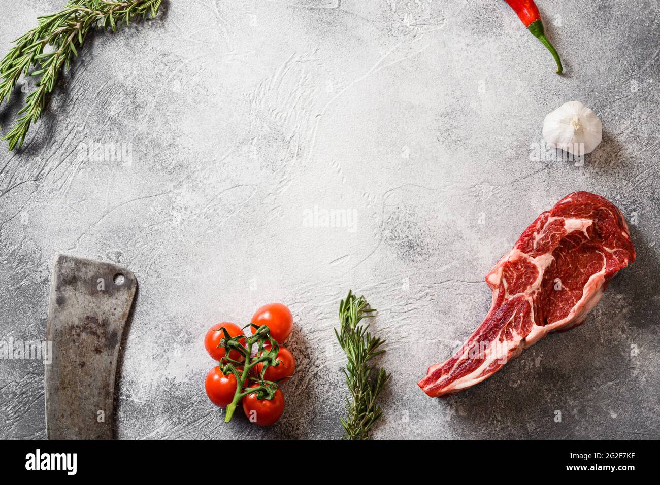 Raw black angus tomahawk steak or Spencer steak cut with the meat ...