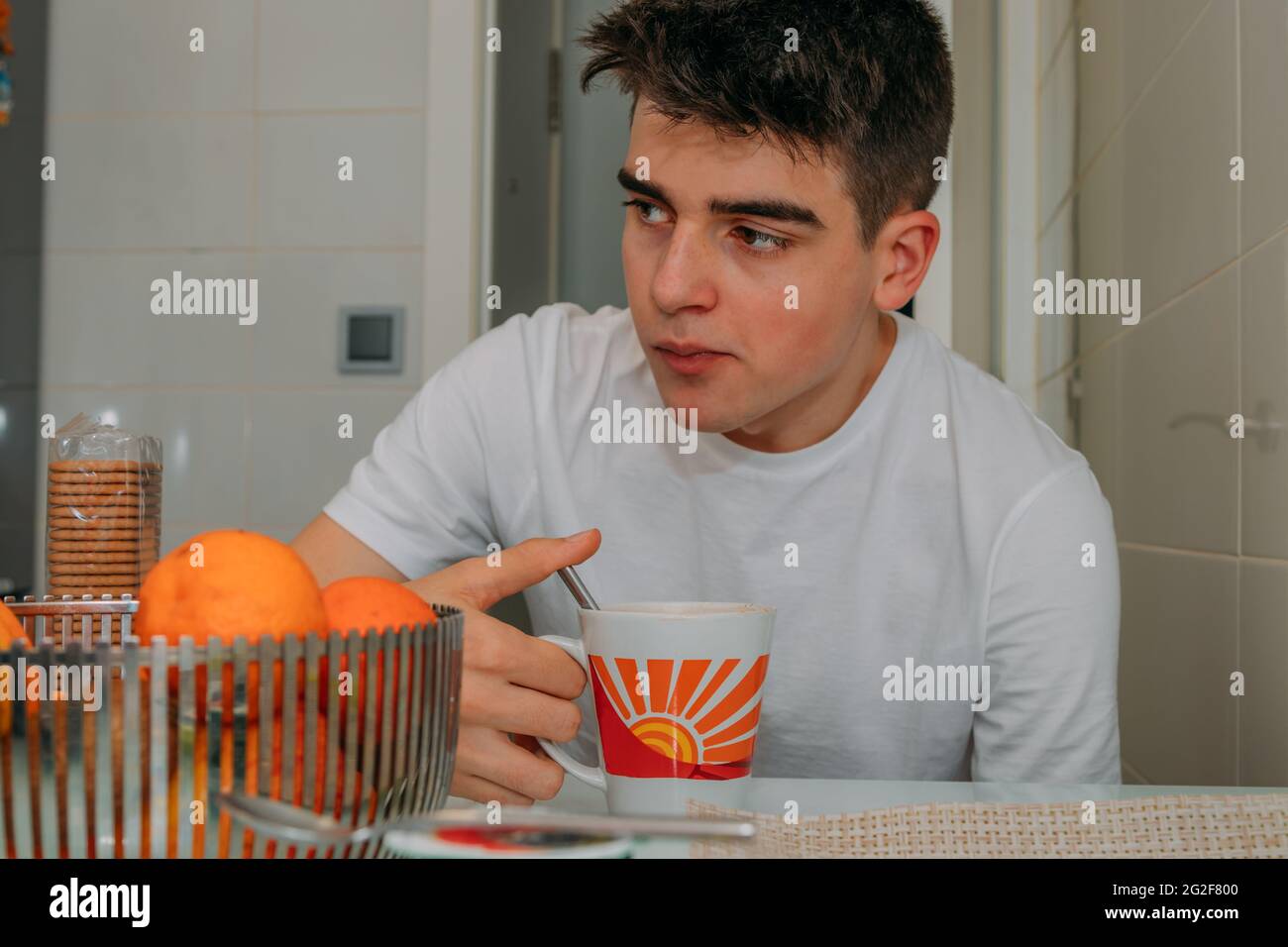 teenage boy having breakfast at home Stock Photo - Alamy