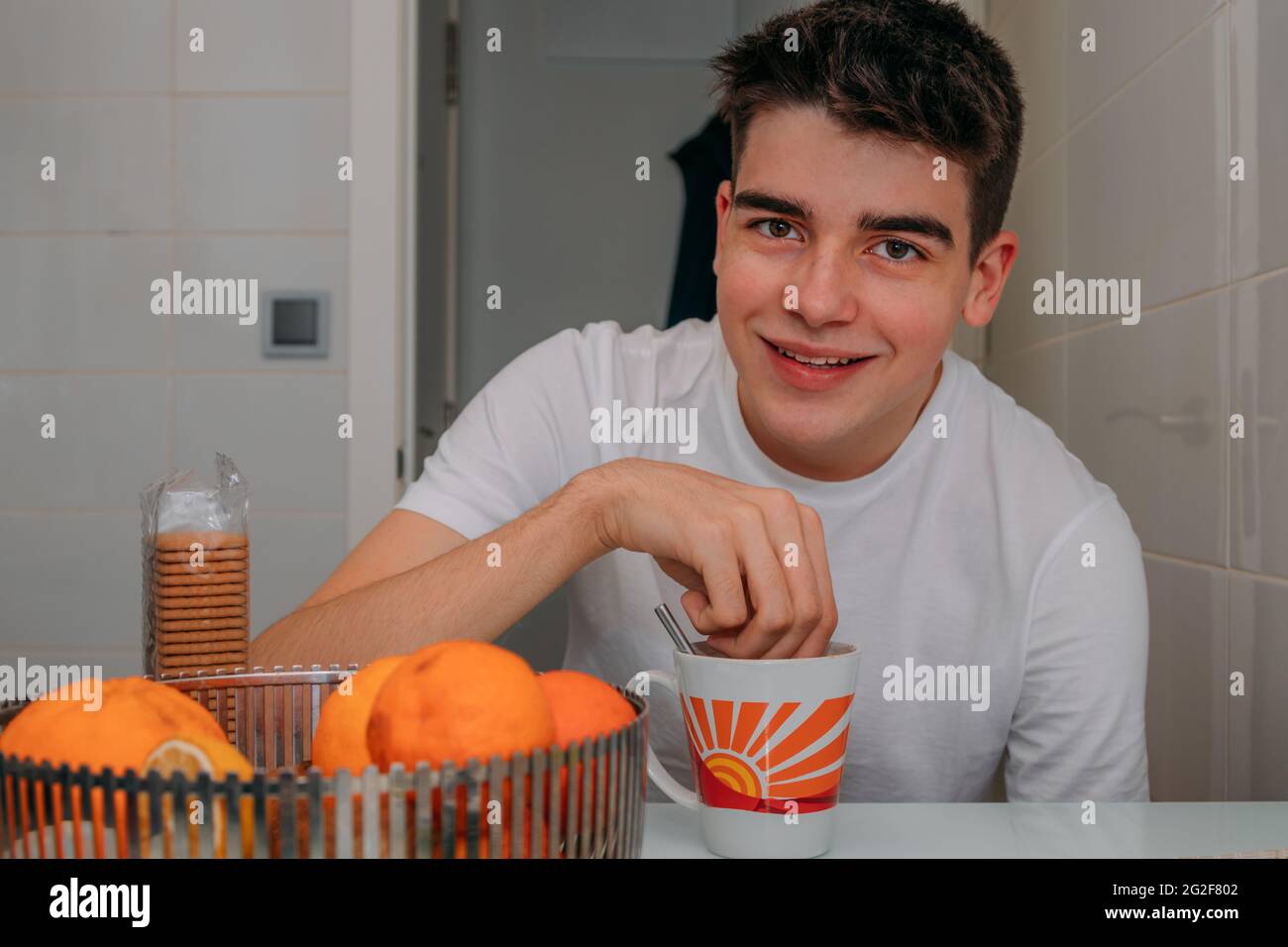 teenage boy having breakfast at home Stock Photo - Alamy