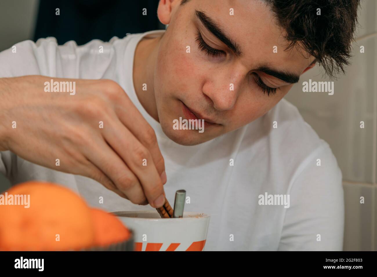 teenage boy having breakfast at home Stock Photo - Alamy