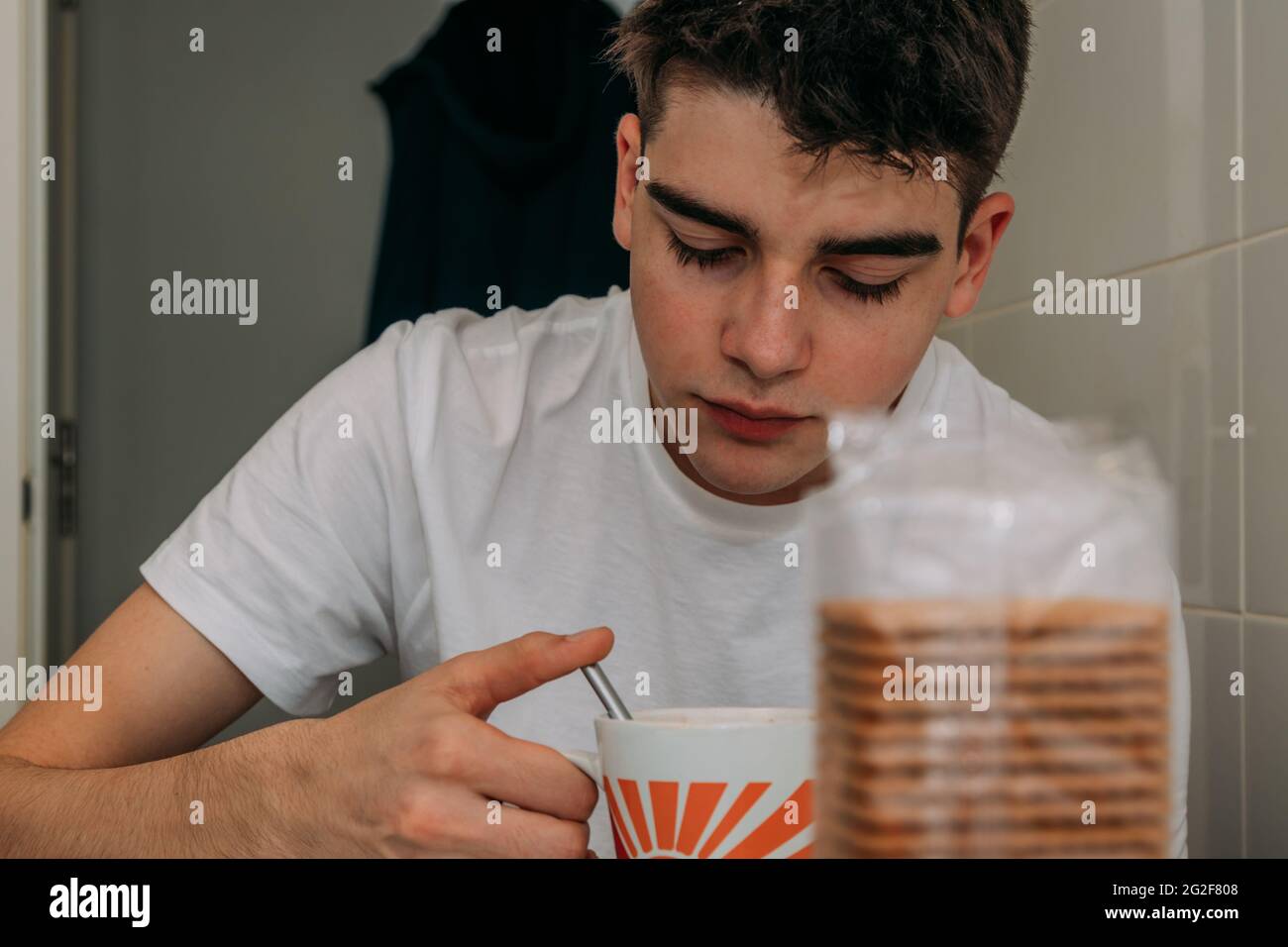 teenage boy having breakfast at home Stock Photo - Alamy