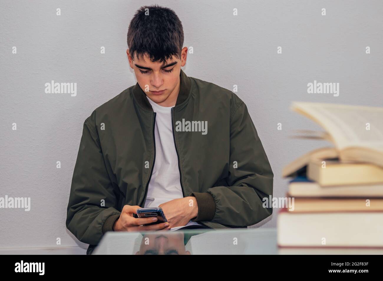 student with mobile phone at home Stock Photo - Alamy