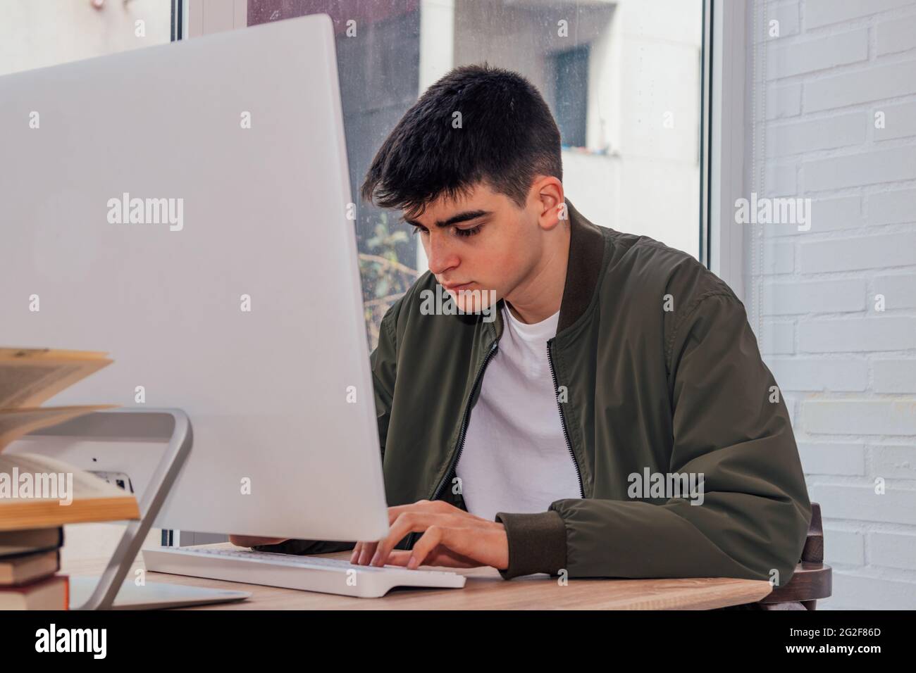 student with computer working or studying Stock Photo - Alamy