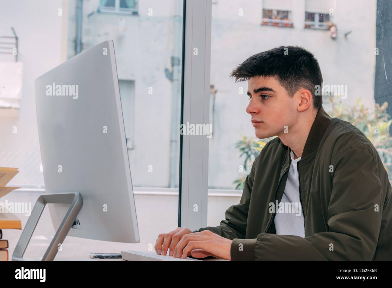 teenage boy working with computer at home Stock Photo - Alamy