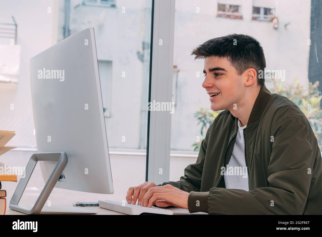 Teenage boy computer games laptop home hi-res stock photography and ...