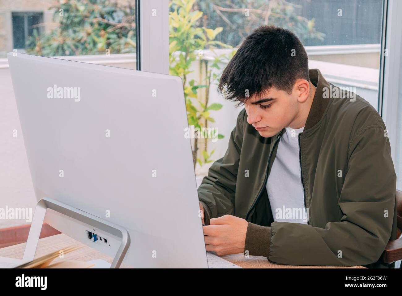 Teenage boy computer games laptop home hi-res stock photography and ...