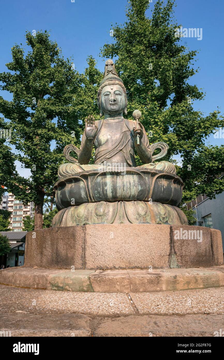 Tokyo, Japan - 12.05.2019: Bronze statue of Buddha sitting with his ...