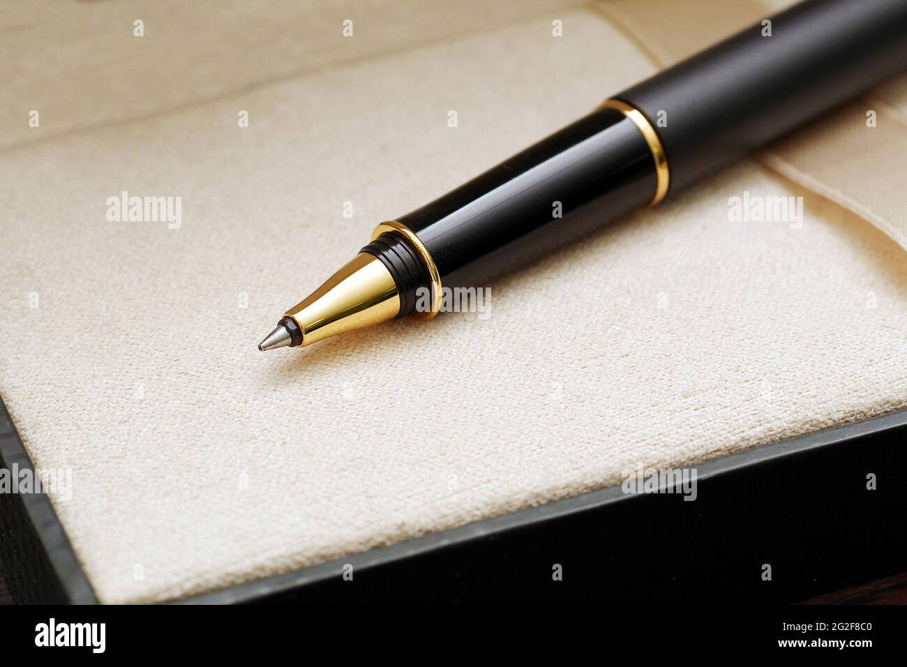 macro of black luxury gold plated ballpoint pen in case Stock Photo - Alamy