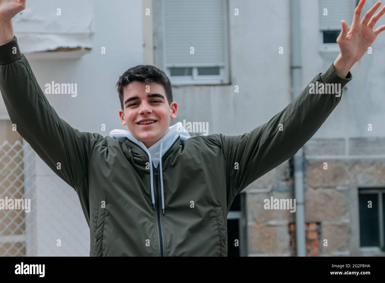 happy young man outdoors celebrating Stock Photo - Alamy