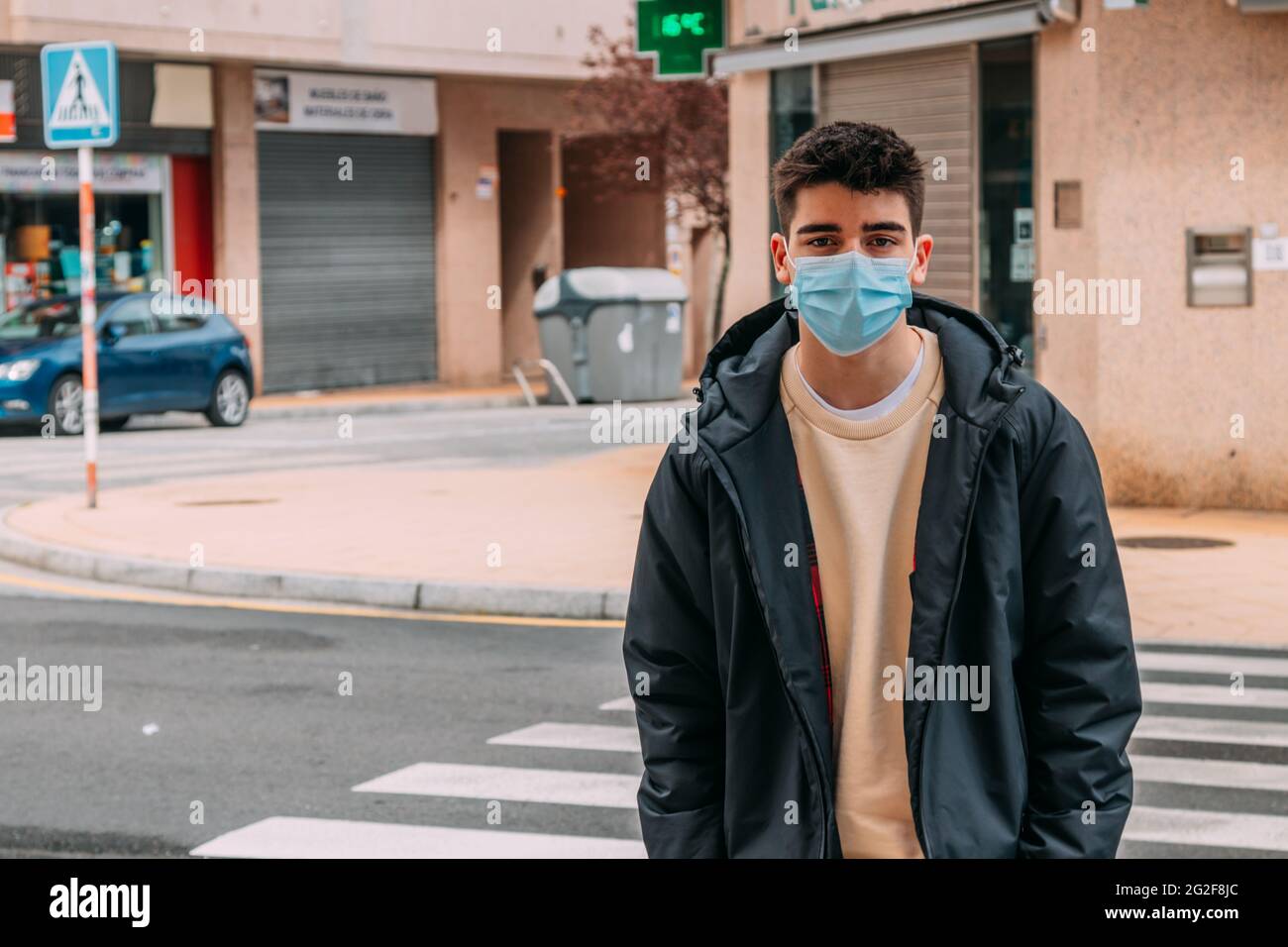 teenage boy with face mask on the street Stock Photo - Alamy