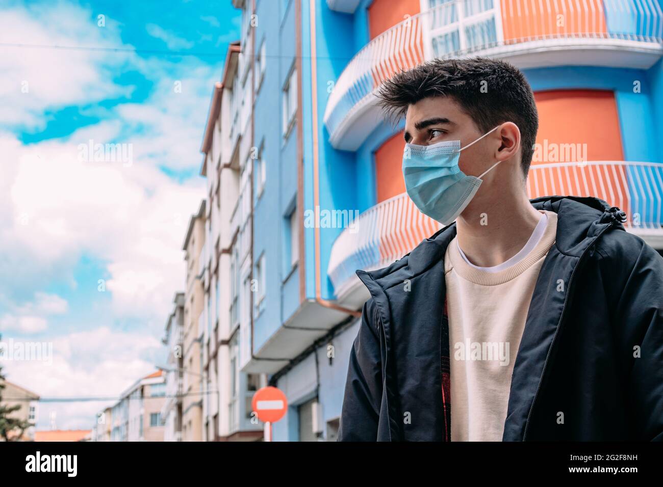 Latin young man mask walking hi-res stock photography and images - Alamy