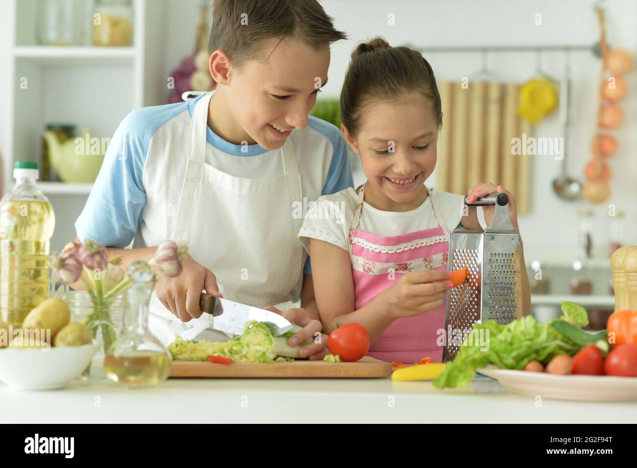 Cute brother and sister cooking together in kitchen Stock Photo - Alamy