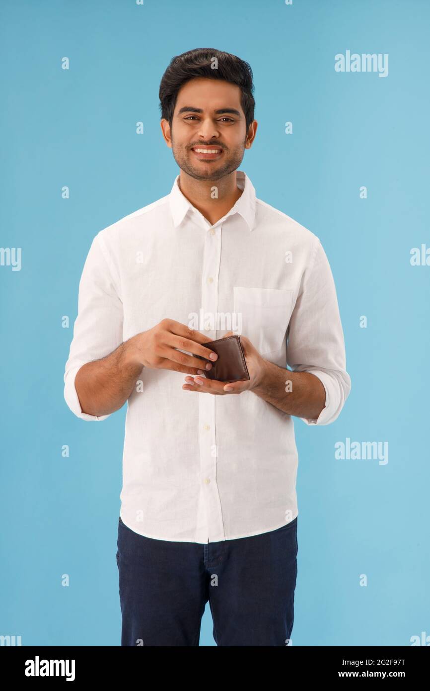 Asian man looking at wallet hi-res stock photography and images - Alamy