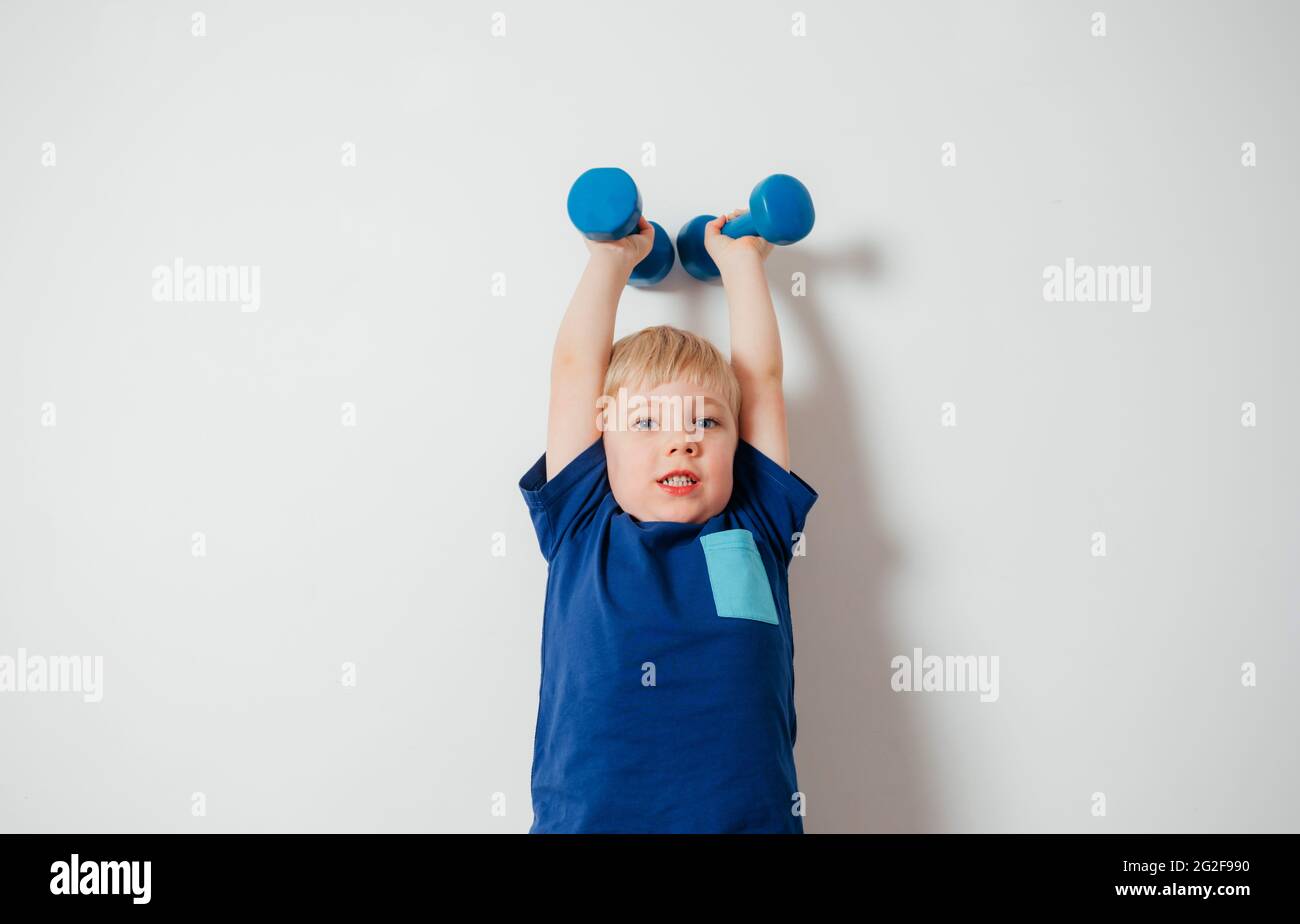Active kids doing sport by following parents example Stock Photo - Alamy