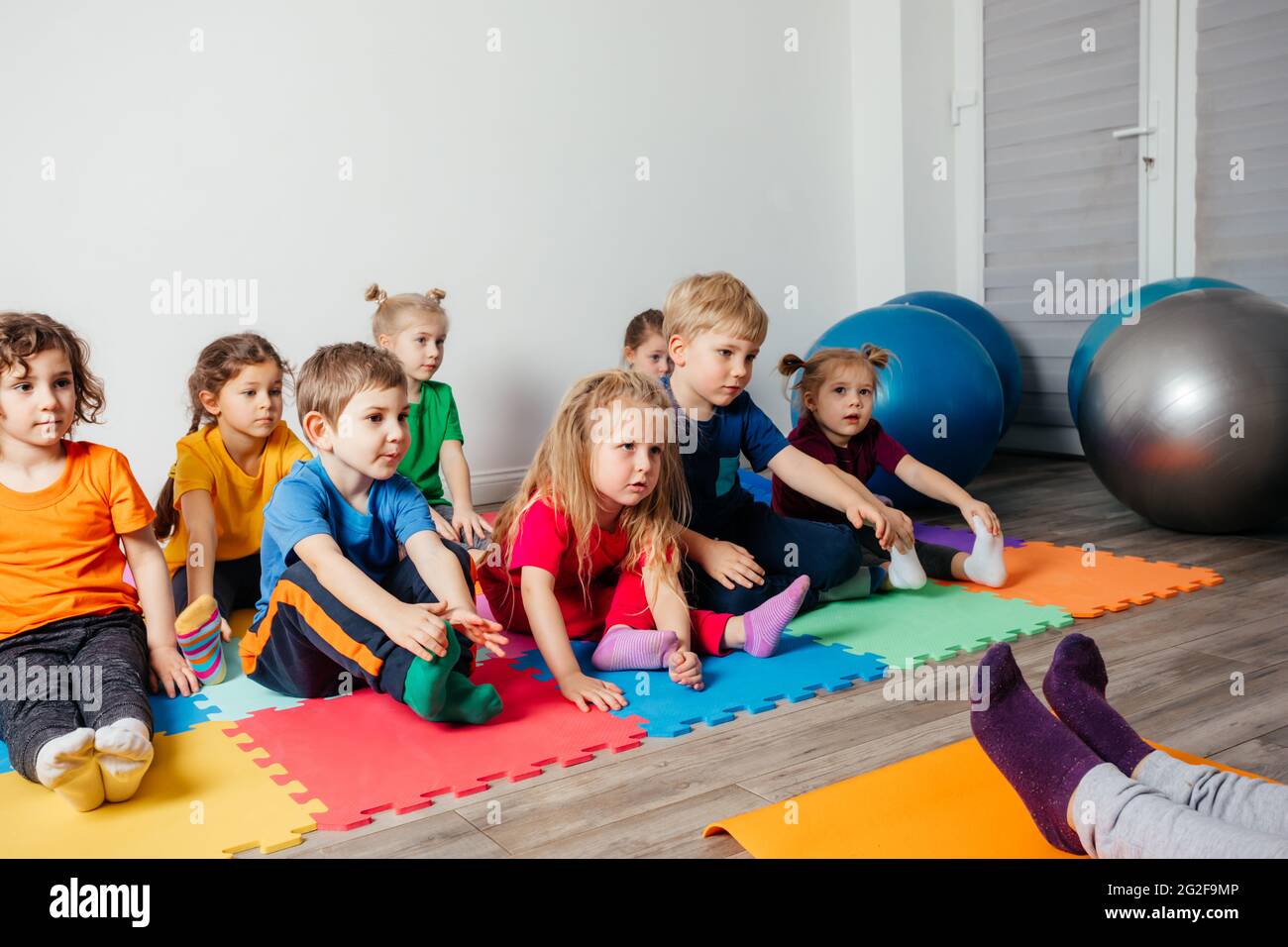 Children exercising while physical education lesson at preschool Stock ...