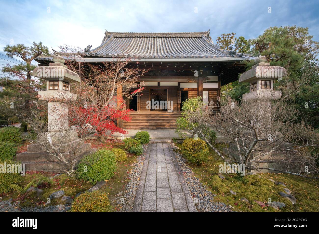 Ancient, small Buddhist shrine with stone lamps and small Japanese ...