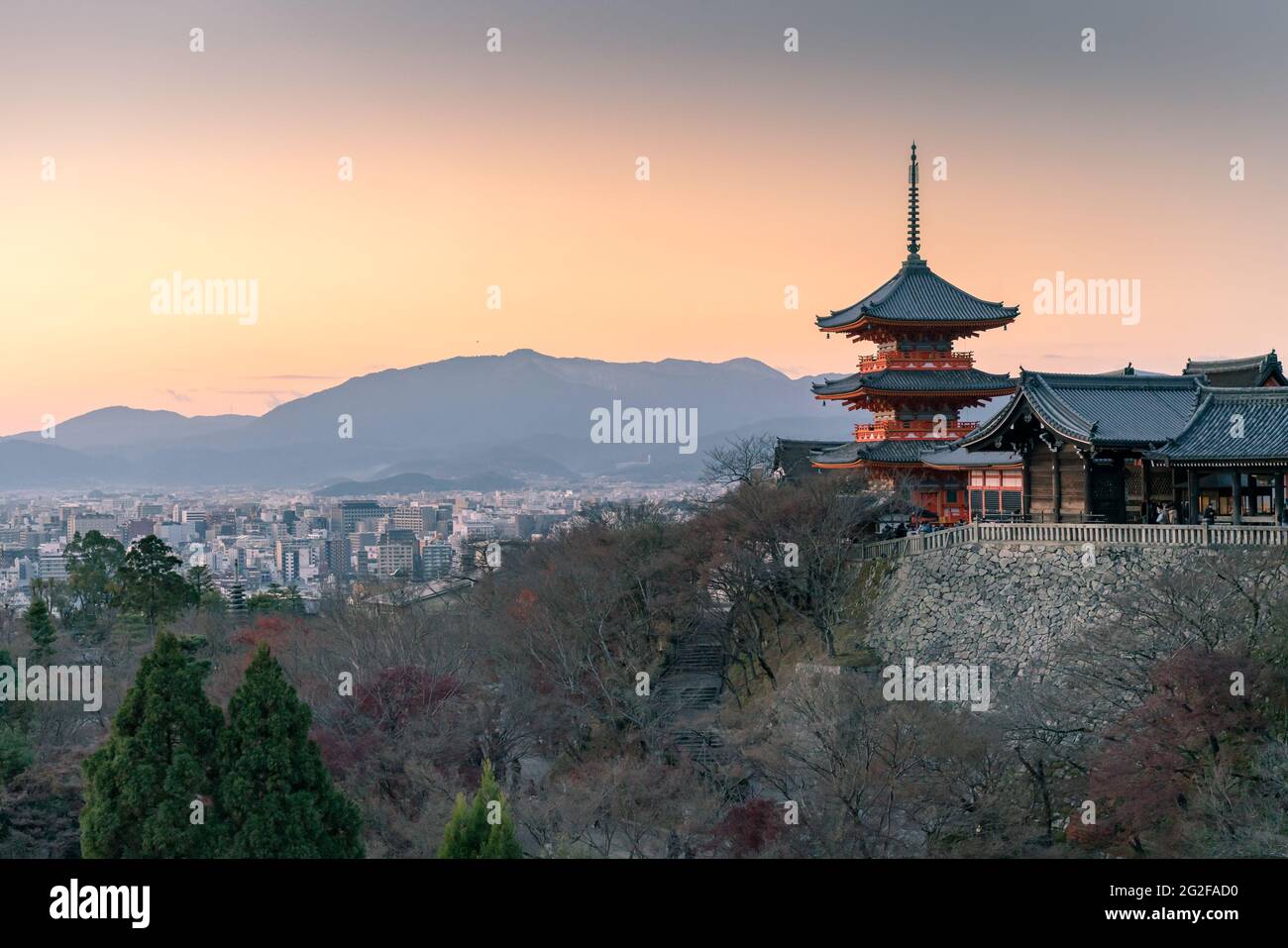 Glowing December sky during sunset over Kyoto city and pagoda of ...