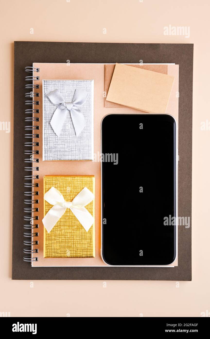 Black mobile smartphone mockup and stationery made from recycled ...
