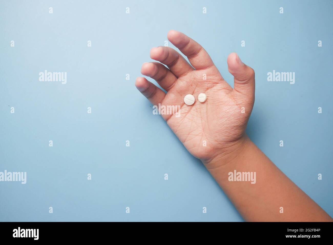 Child taking pills hi-res stock photography and images - Alamy