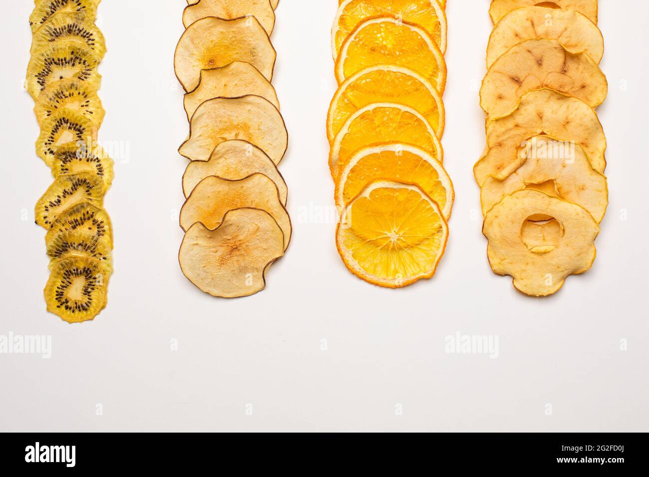 The dry pieces of different fruits in a row to fresh fruits Stock Photo ...