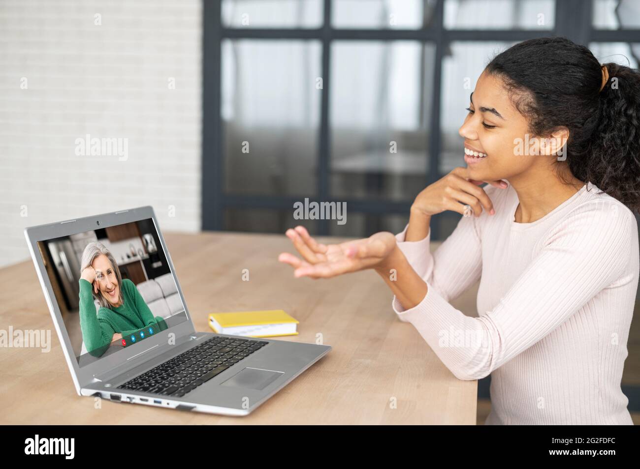 African American businesswoman using application for distance video ...