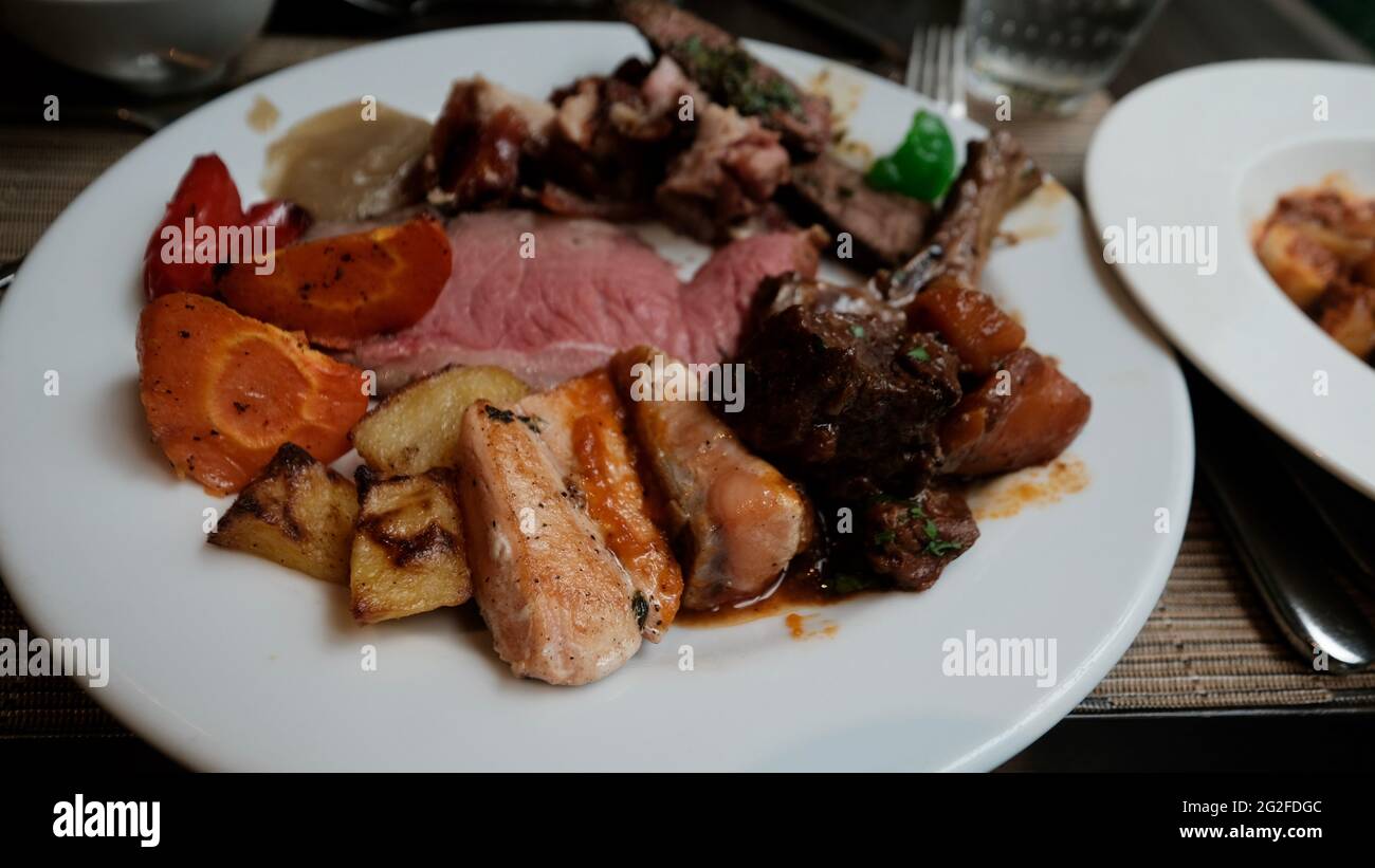 Buffet food red meat cuisineon a plate sit down eating out five star ...