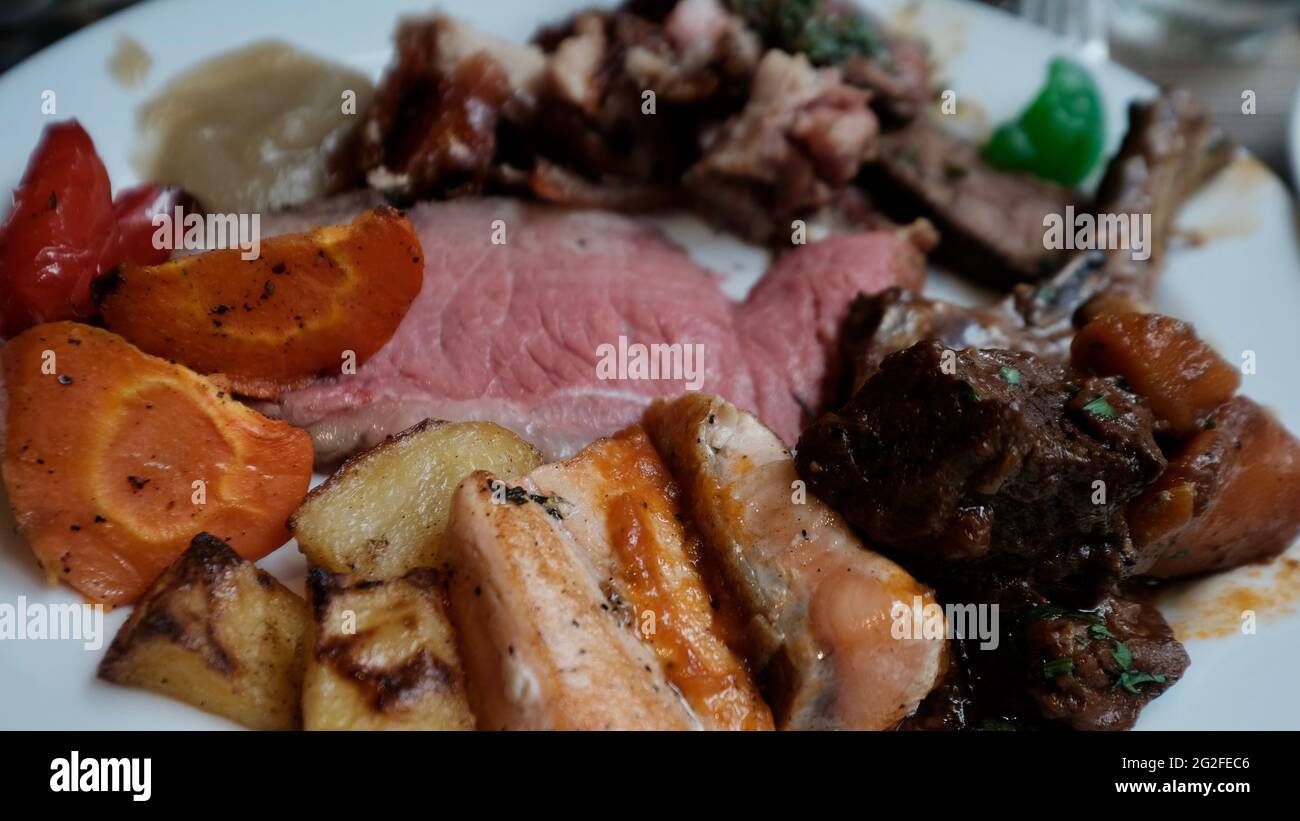 Buffet smorgasbord food on a plate sit down eating out five star casual ...