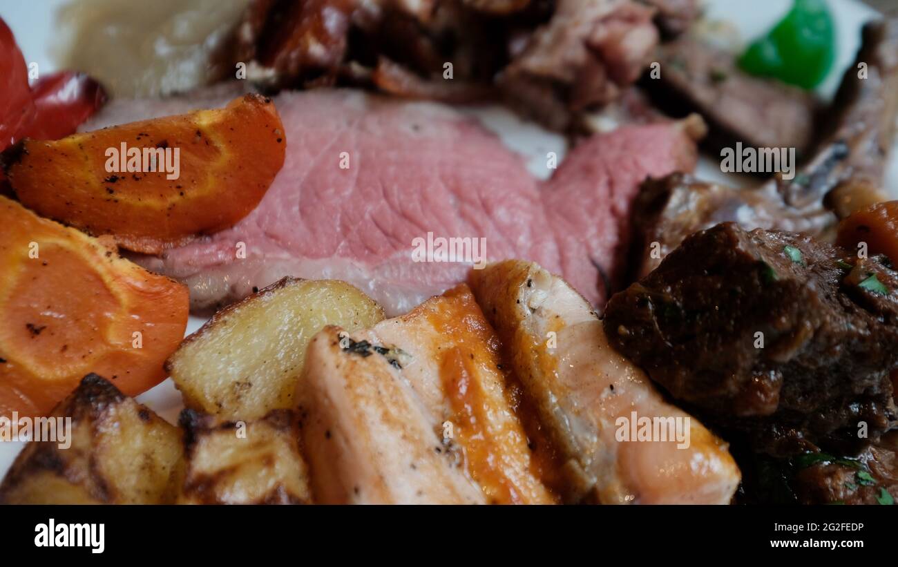 Buffet smorgasbord food on a plate sit down eating out five star casual ...