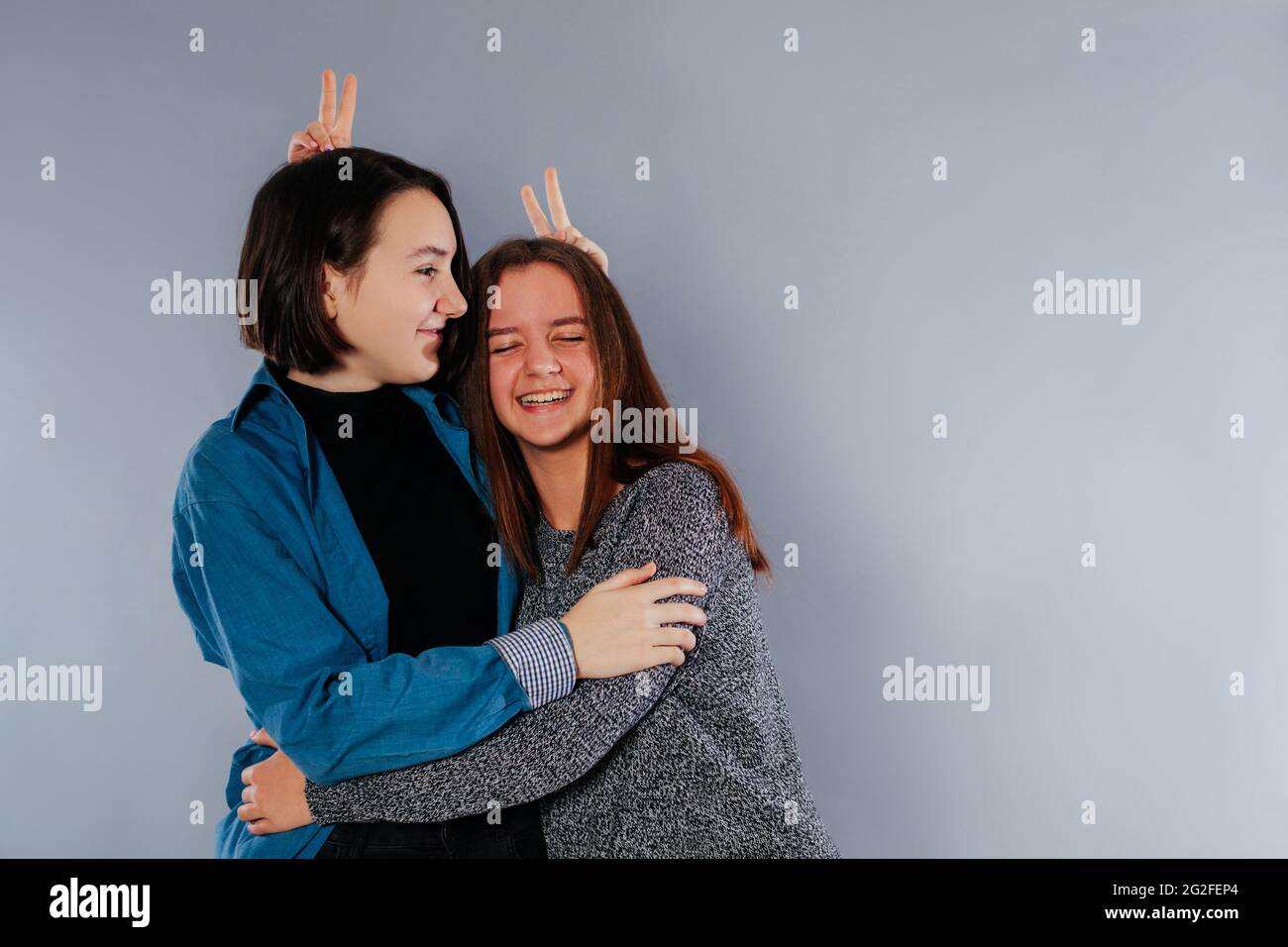 Two teenage sisters are hugging each other Stock Photo - Alamy Two teenage sisters are hugging each other Stock Photo - Alamy