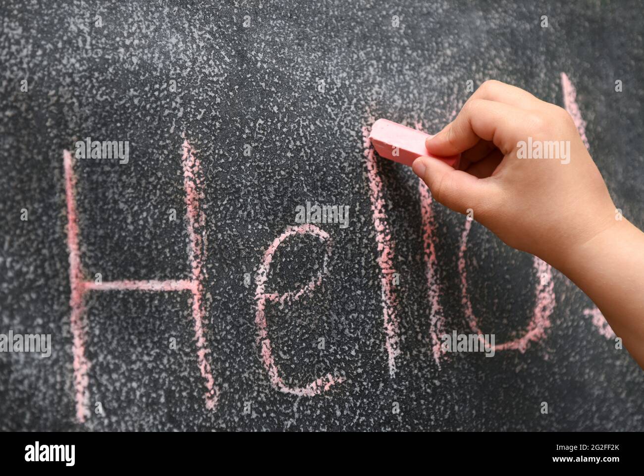 Children hand learn to write on the drawing board Stock Photo - Alamy