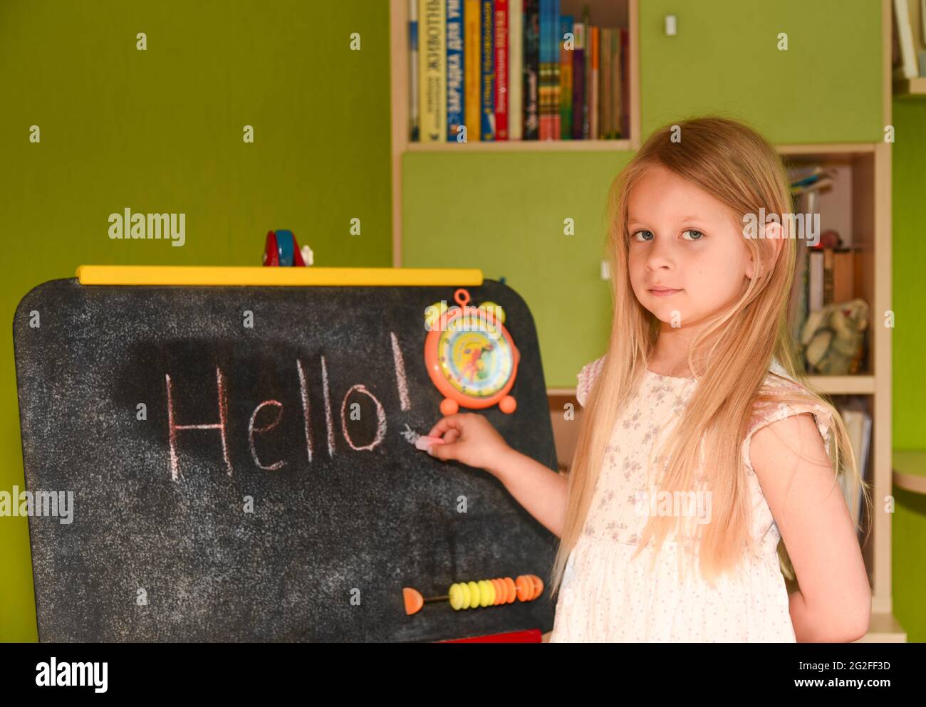 Child girl learning to write on drawing board at home Stock Photo - Alamy