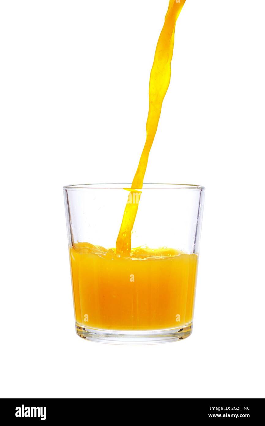 pouring orange juice in glass isolated on white background Stock Photo ...