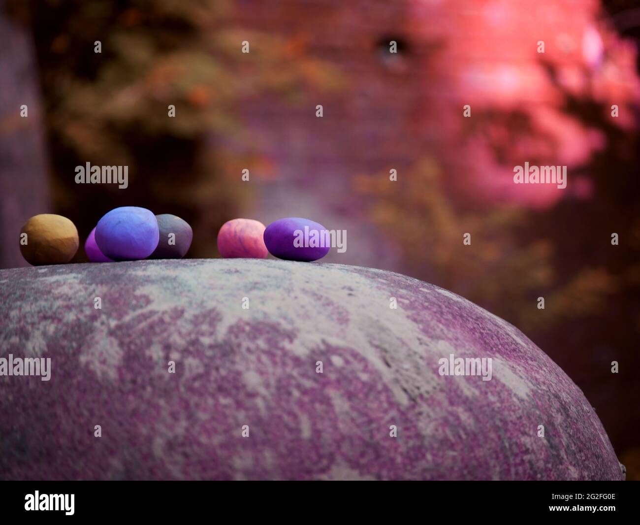 Colorful clay balls presented around garden background Stock Photo - Alamy