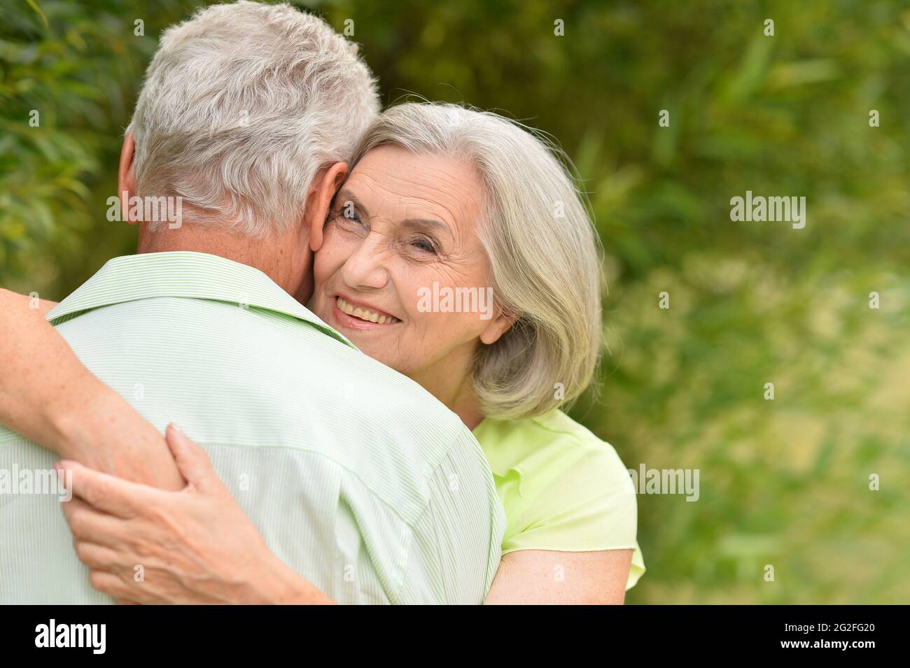 Porait of senior couple posing in the park Stock Photo - Alamy