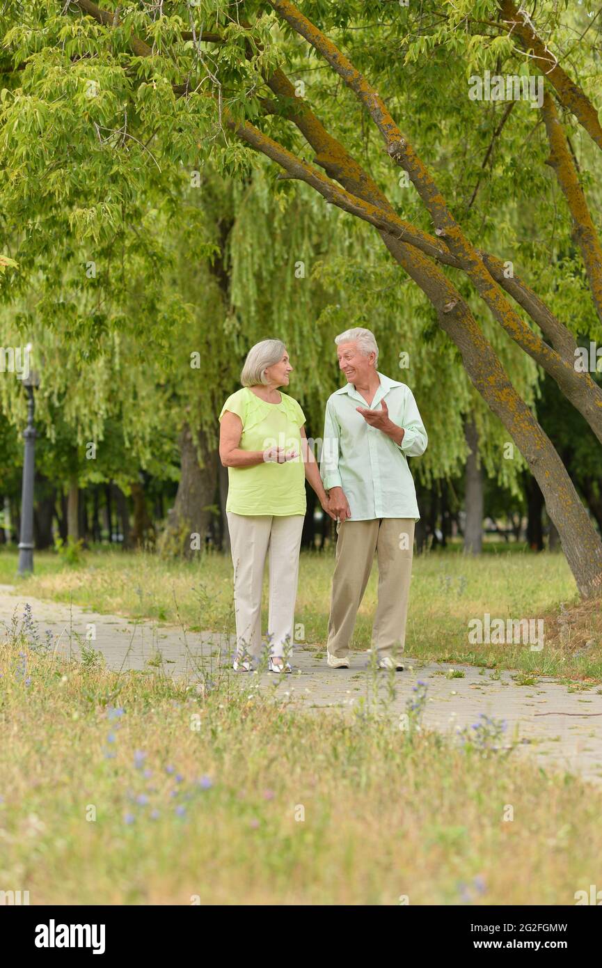Porait of senior couple posing in the park Stock Photo - Alamy