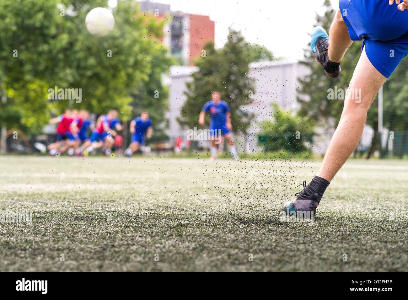 Blurry of the ball after soccer player shoot it at corner of football ...
