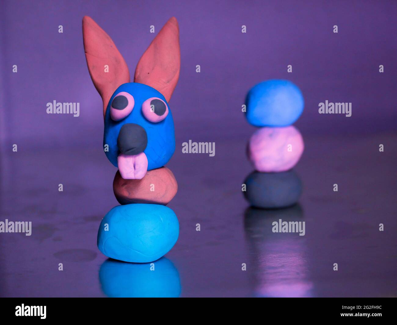 Rabbit made with clay presenting blue color long teeth Stock Photo - Alamy
