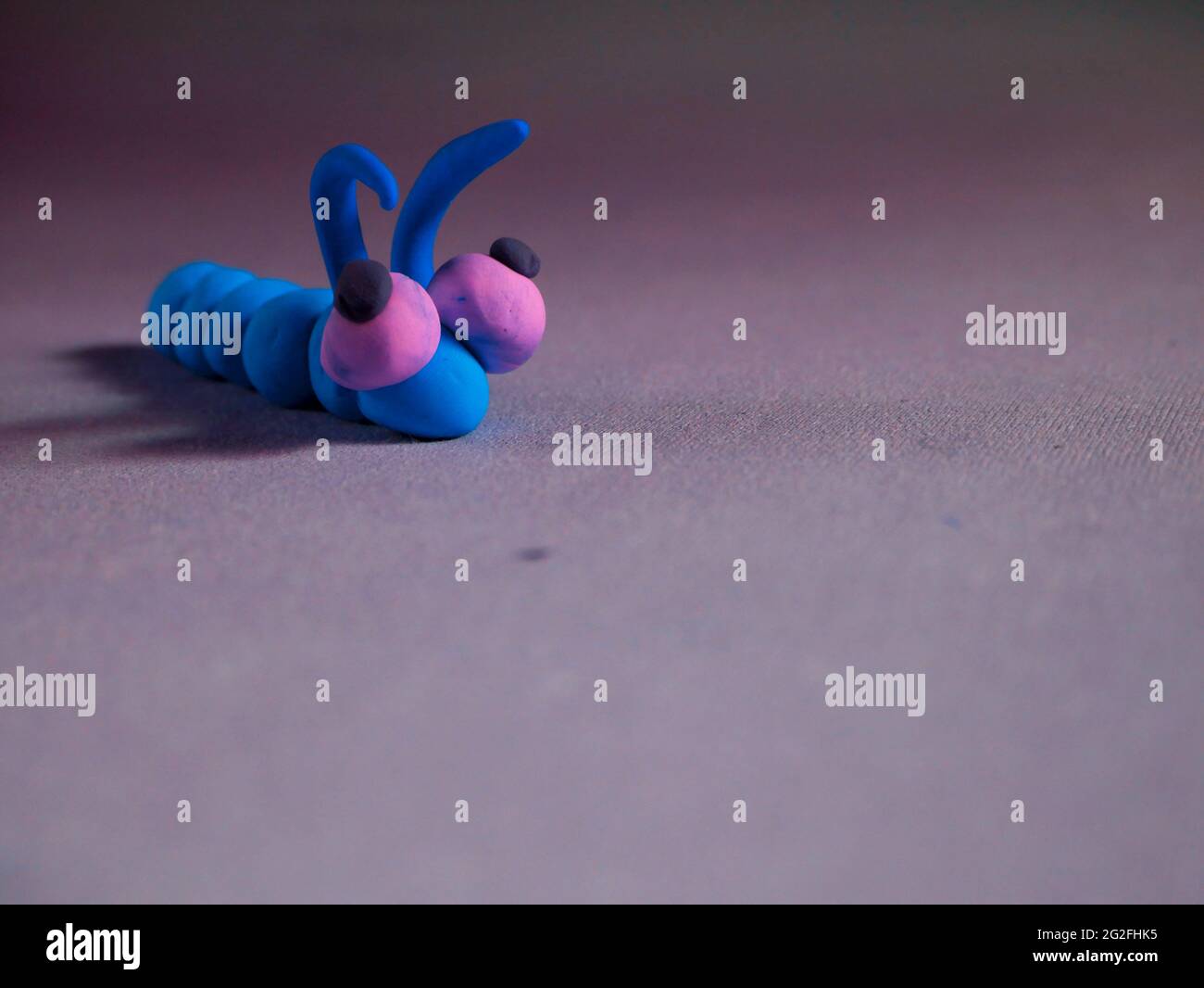 Blue clay warms creature cartoon isolate on light background Stock ...