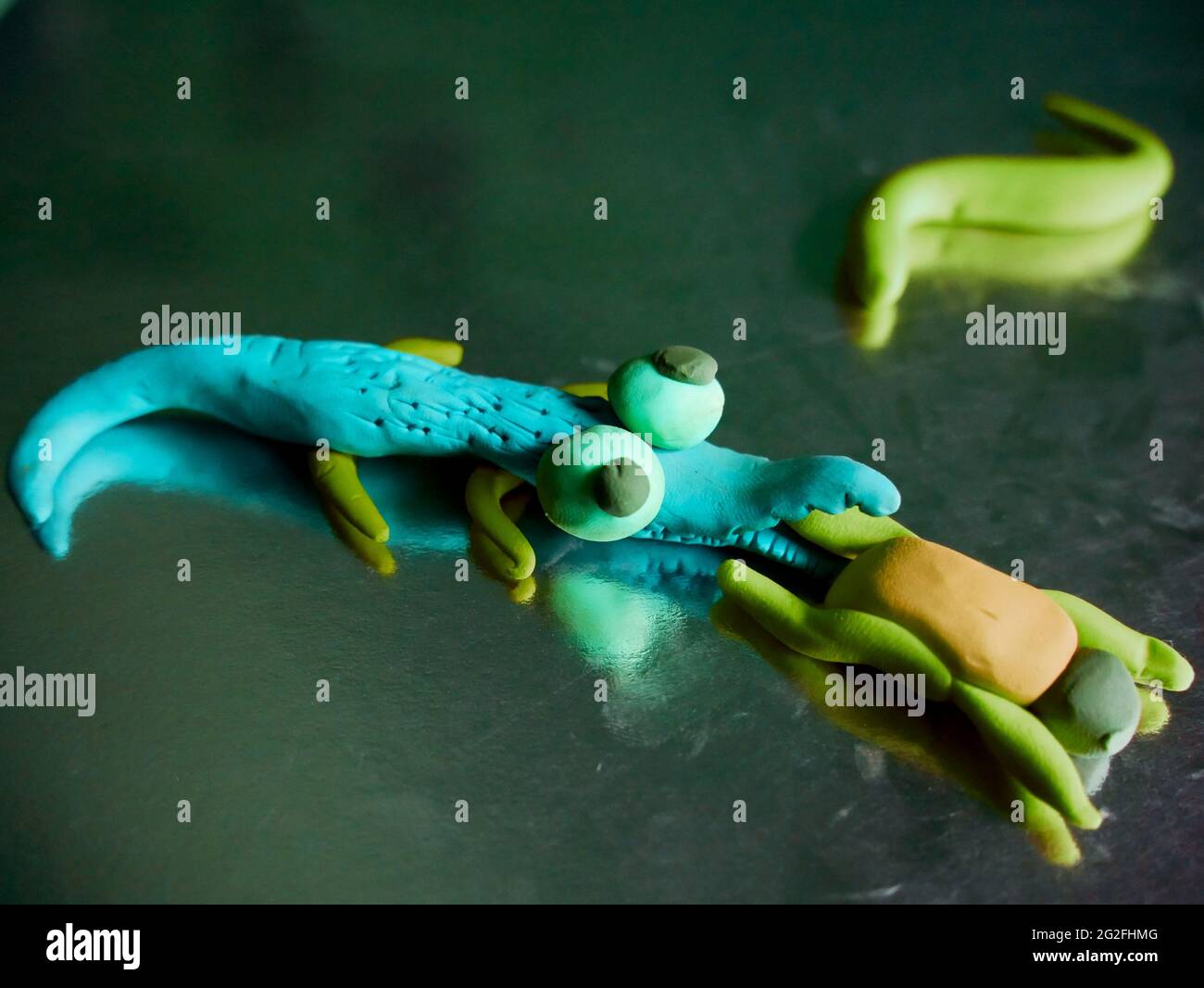Crocodile eating man with his sharp teeth clay art presented with ...